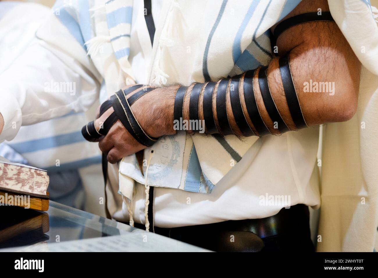 Young man practicing the reading of the Torah prior to Bar Mitzvah ...