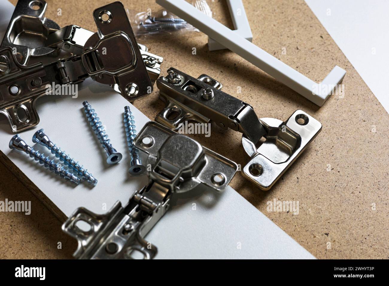 Furniture fittings. Furniture assembly hardware options and tools on a ...