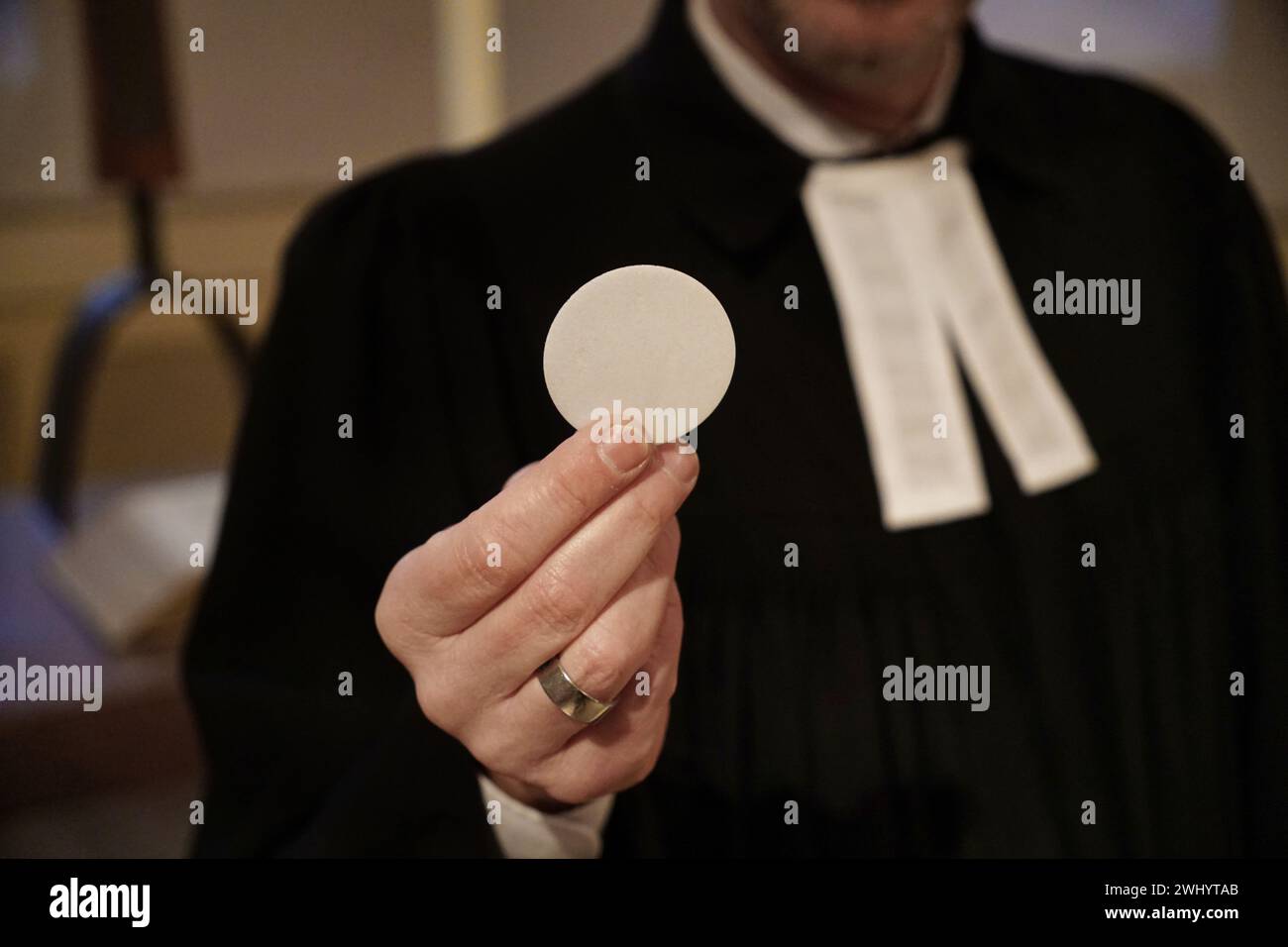 Pastor at communion Stock Photo - Alamy