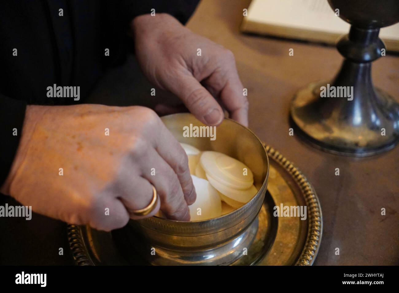 Pastor at communion Stock Photo - Alamy