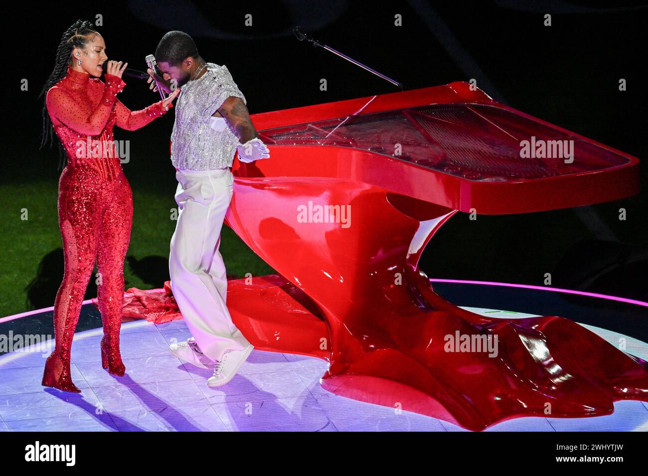 Alicia Keys performs with Usher during the Apple Music Halftime Show at ...