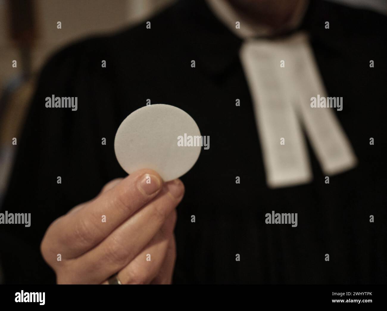 Pastor at communion Stock Photo - Alamy