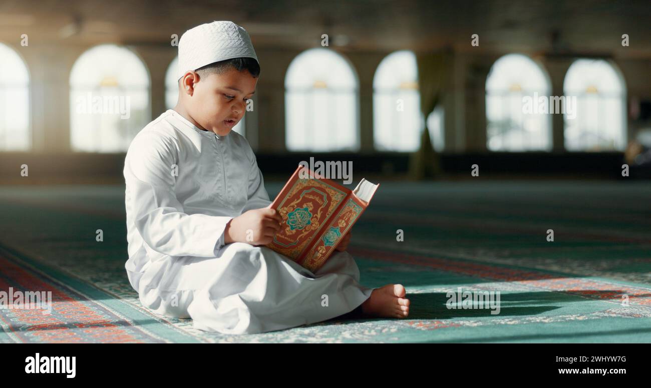Islam, boy in mosque reading Quran for learning mindfulness and ...