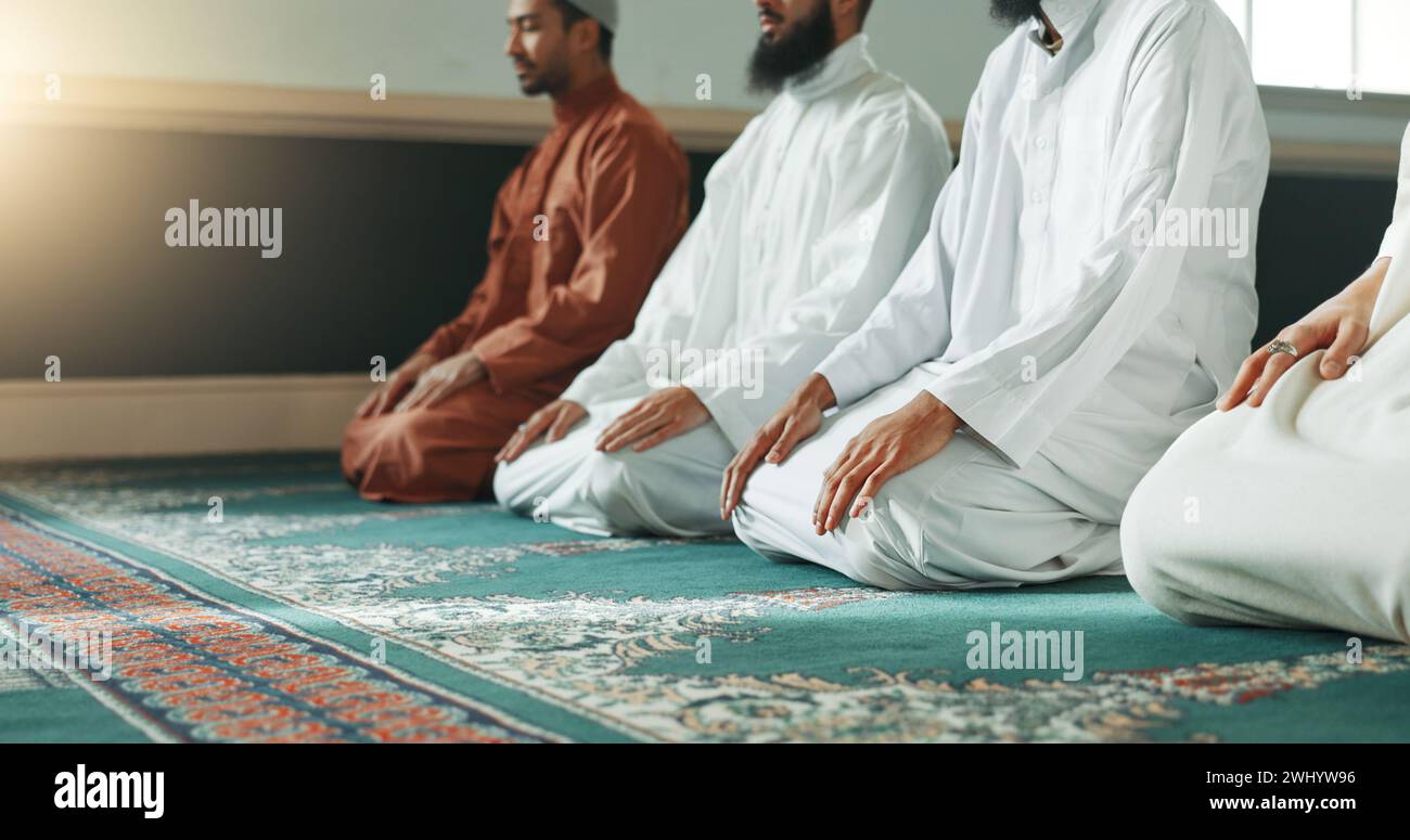 Muslim, praying and men in a Mosque for spiritual religion together as ...