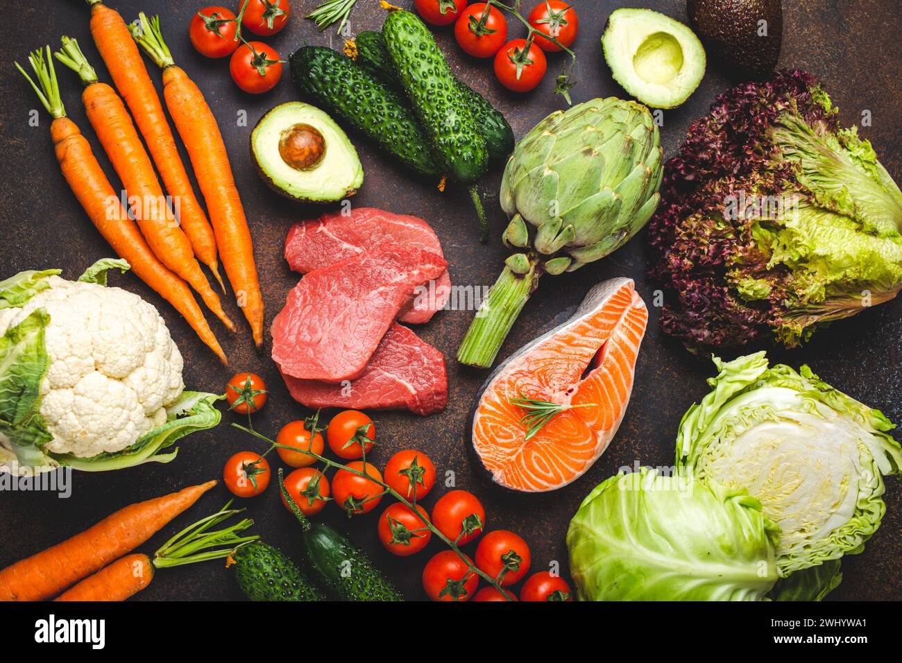 Assorted food raw products: vegetables, beef meat, fish salmon fillet ...
