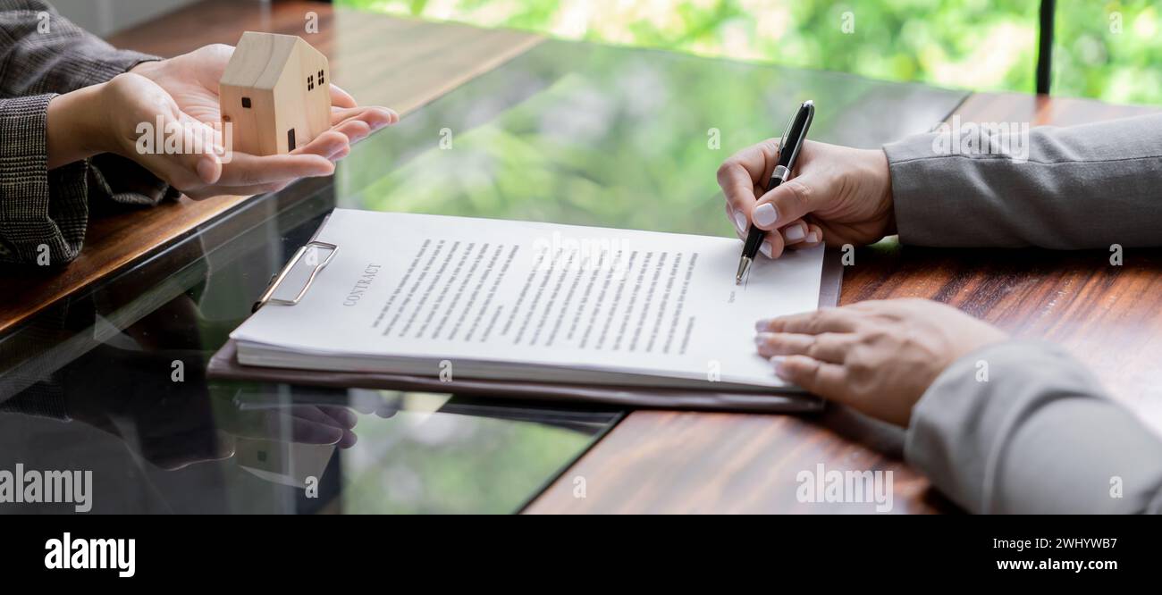 Business people signing contract making deal with real estate agent ...