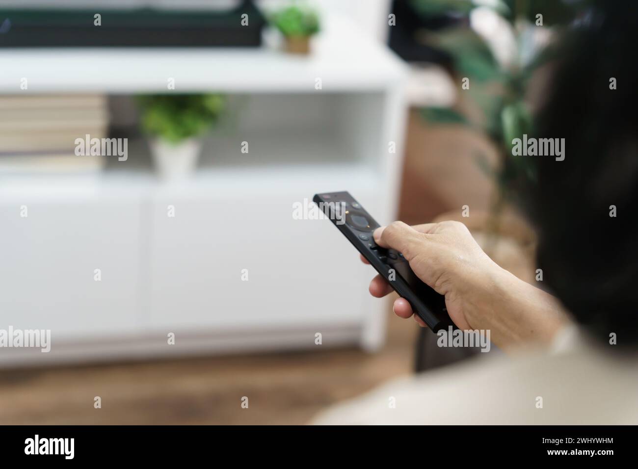 Elderly woman Watching smart TV and using remote controller Hand Stock ...