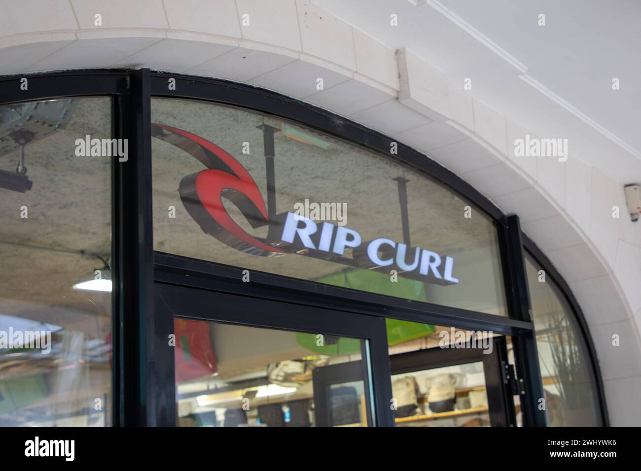 arcachon , France - 02 12 2024 : rip curl logo text and brand sign clothes facade entrance store ...