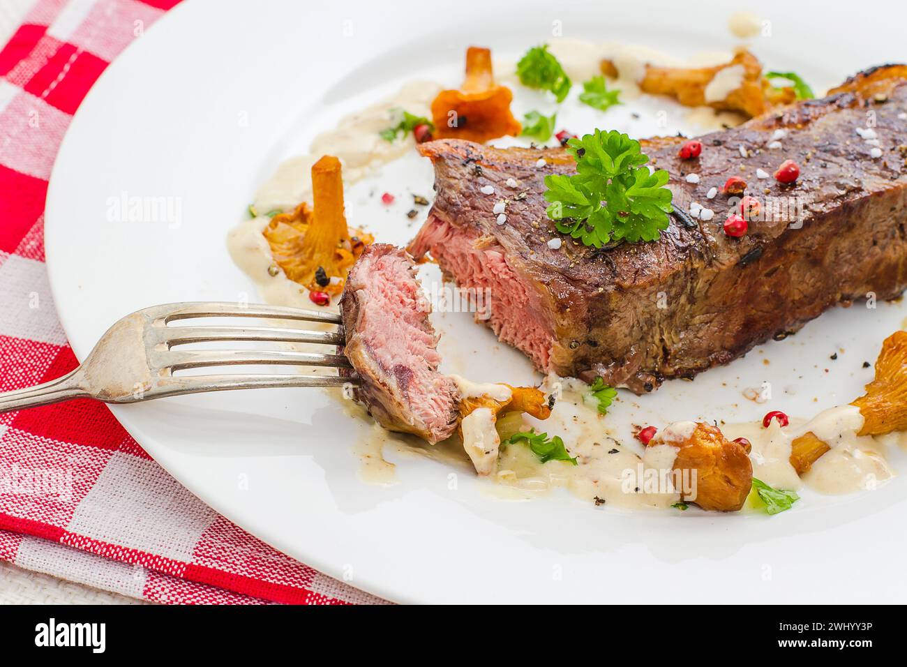 Grilled rump steak with chanterelle mushrooms Stock Photo - Alamy