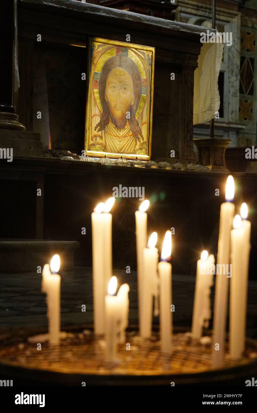 Sacrificial candles in front of the image of Christ Church of St. Mary ...