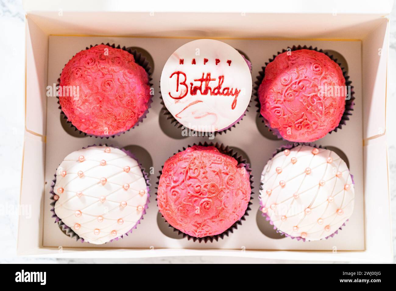 Creating Extravagant Cupcakes for Birthday Celebration Stock Photo - Alamy
