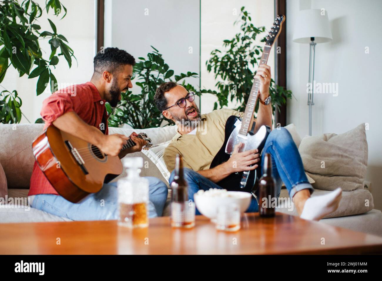 Best friends, musician jamming together. Playing music on guitar ...