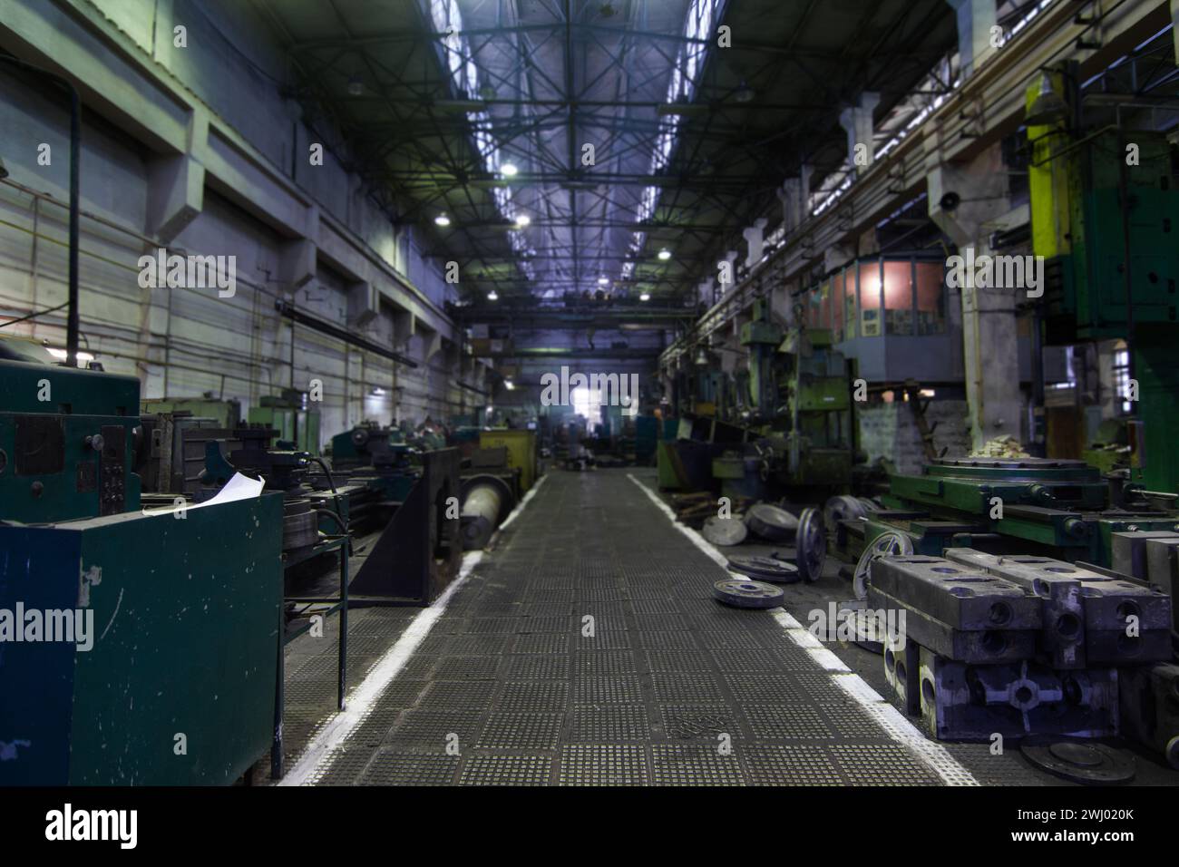 Industrial facility interior with machinery. Mechanical workshop with ...