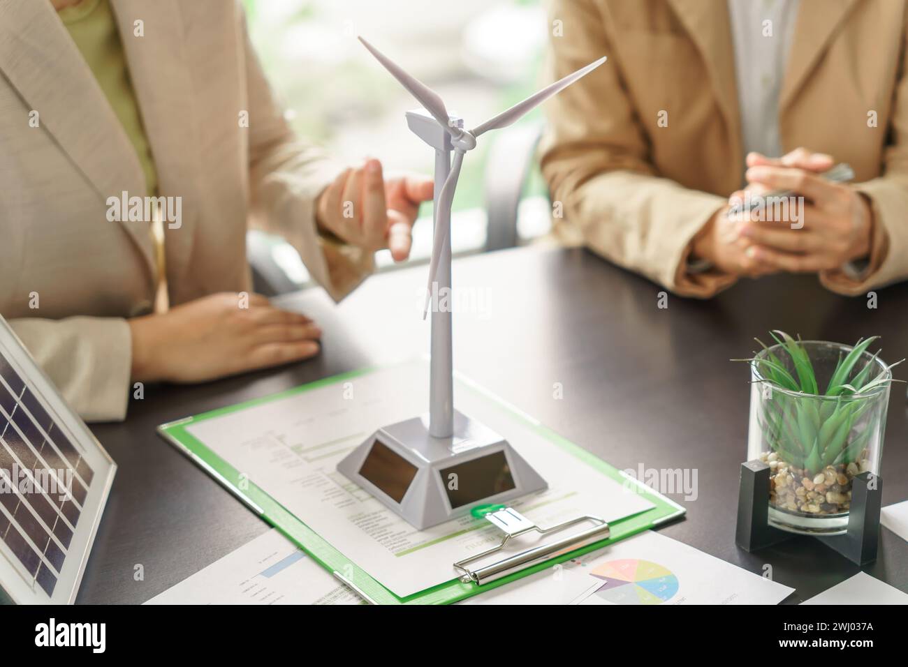 Solar panels green energy Business people working in green eco friendly office business meetingÂ ...