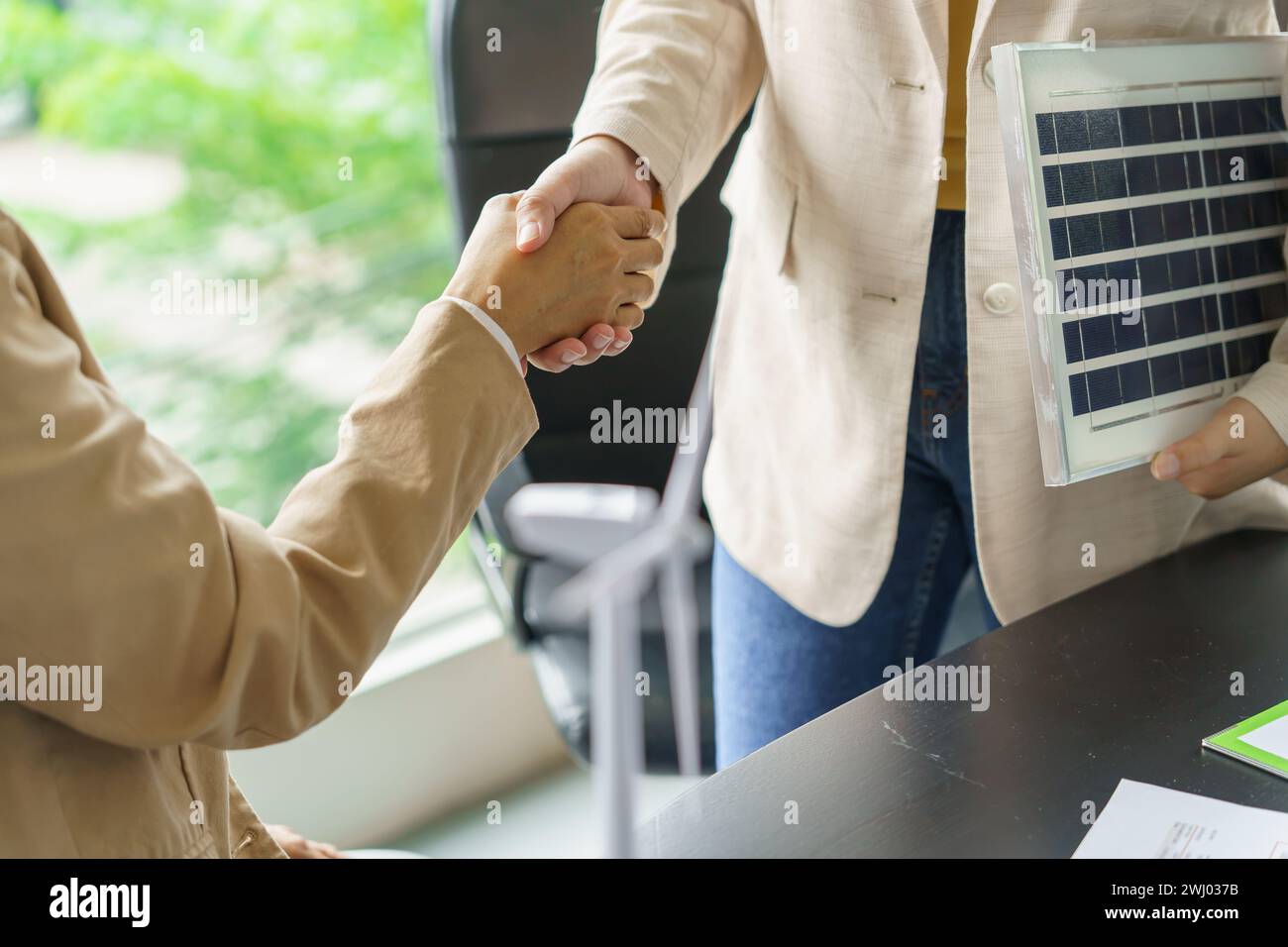 Handshake and business with solar panels green energy Business people ...