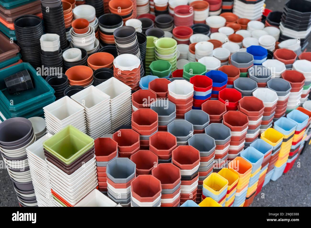 Many different shapes, round, square and color plastic pots for growing ...