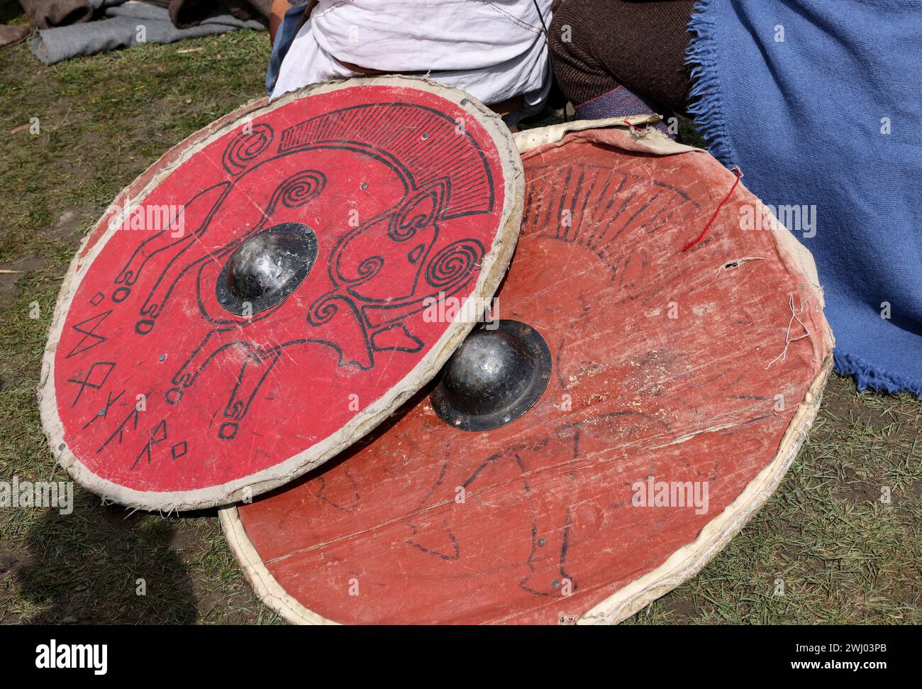Medieval weapons, shields in knight camp at the festival of historical ...