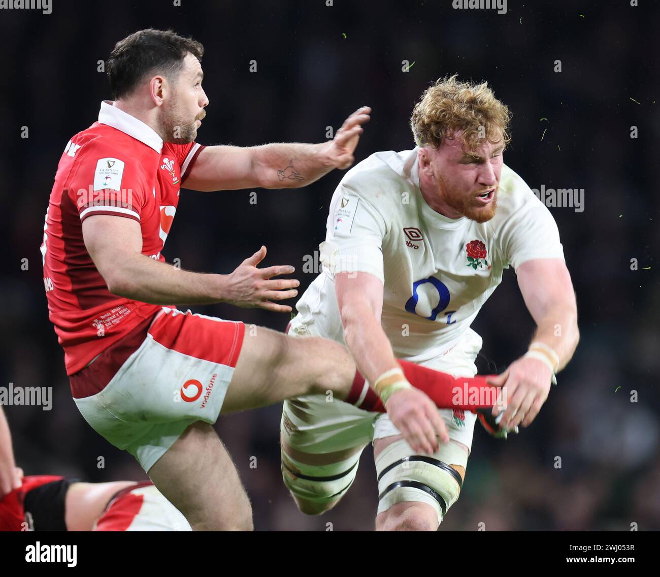 L-R Tomos Williams (Cardiff Rugby) of Wales and England's Ollie Chessum ...