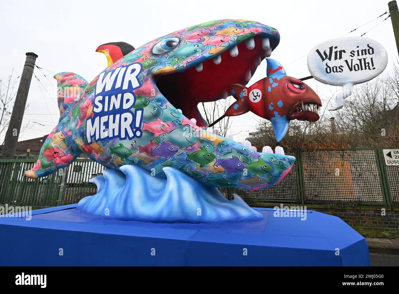 Duesseldorf, Germany. 12th Feb, 2024. A float with two fish "We are more" "We are the people" is ...