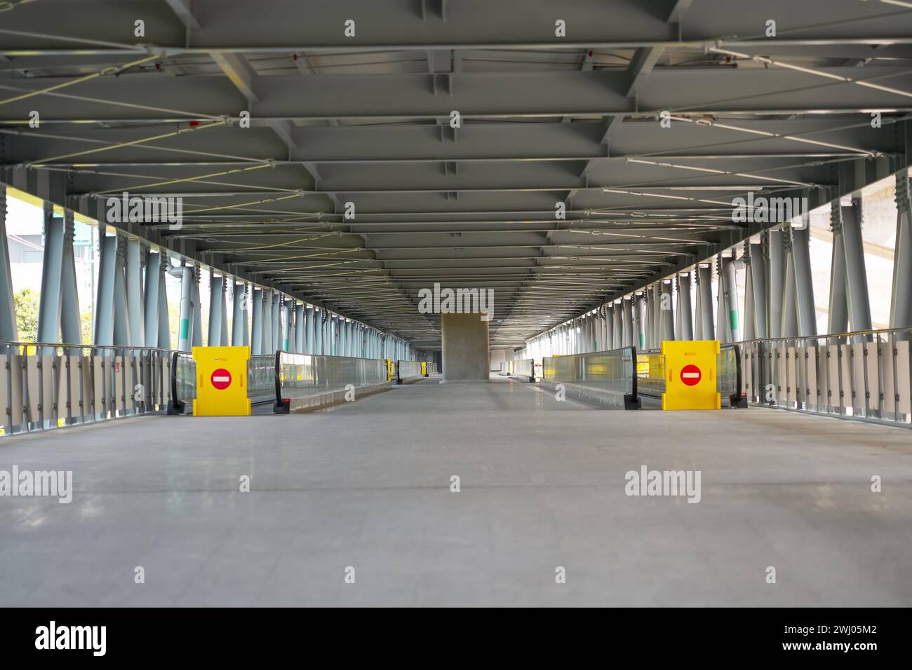 Long Bridge Corridor, Yellow fence with a brick sign, passage is ...