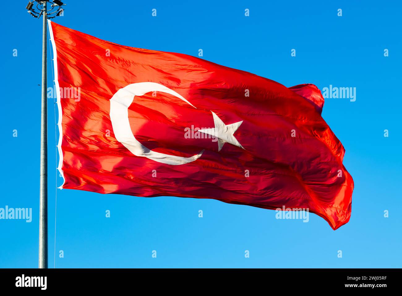 Waving Turkish flag isolated on blue sky background. National holidays ...