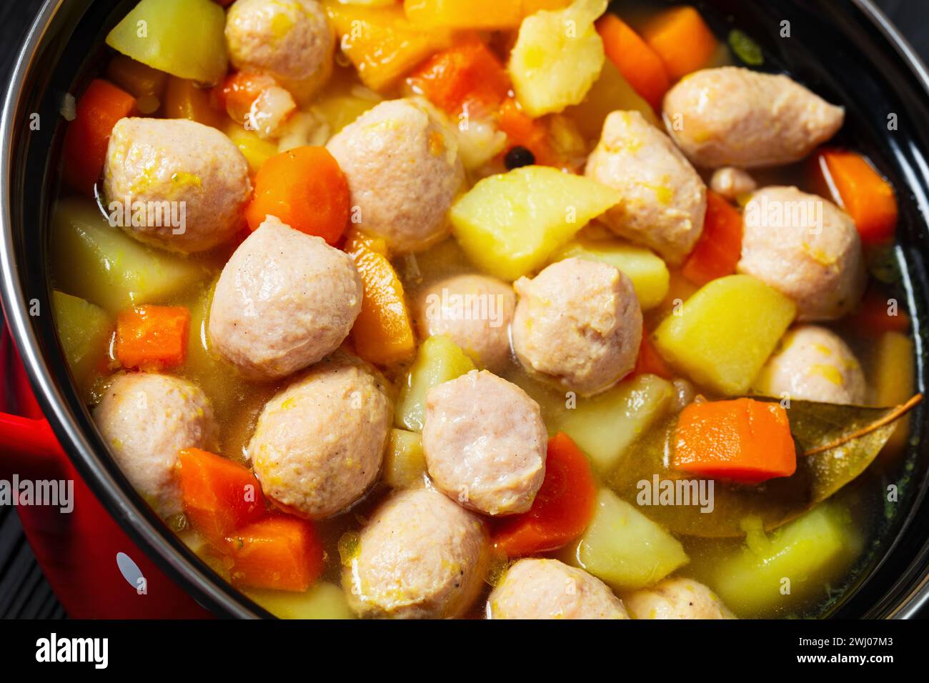 close-up of siskonmakkarakeitto, finnish sausage soup with rutabaga ...