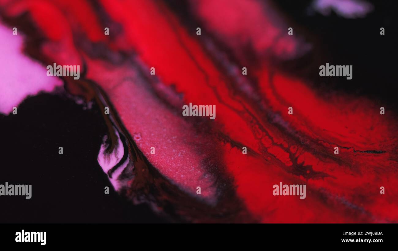 Paint splash glitter fluid texture red black ink Stock Photo - Alamy