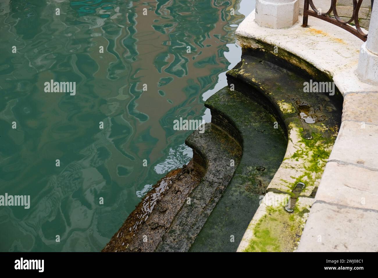 Stone Stairs covered with algae along a canal during low tide in Venice ...