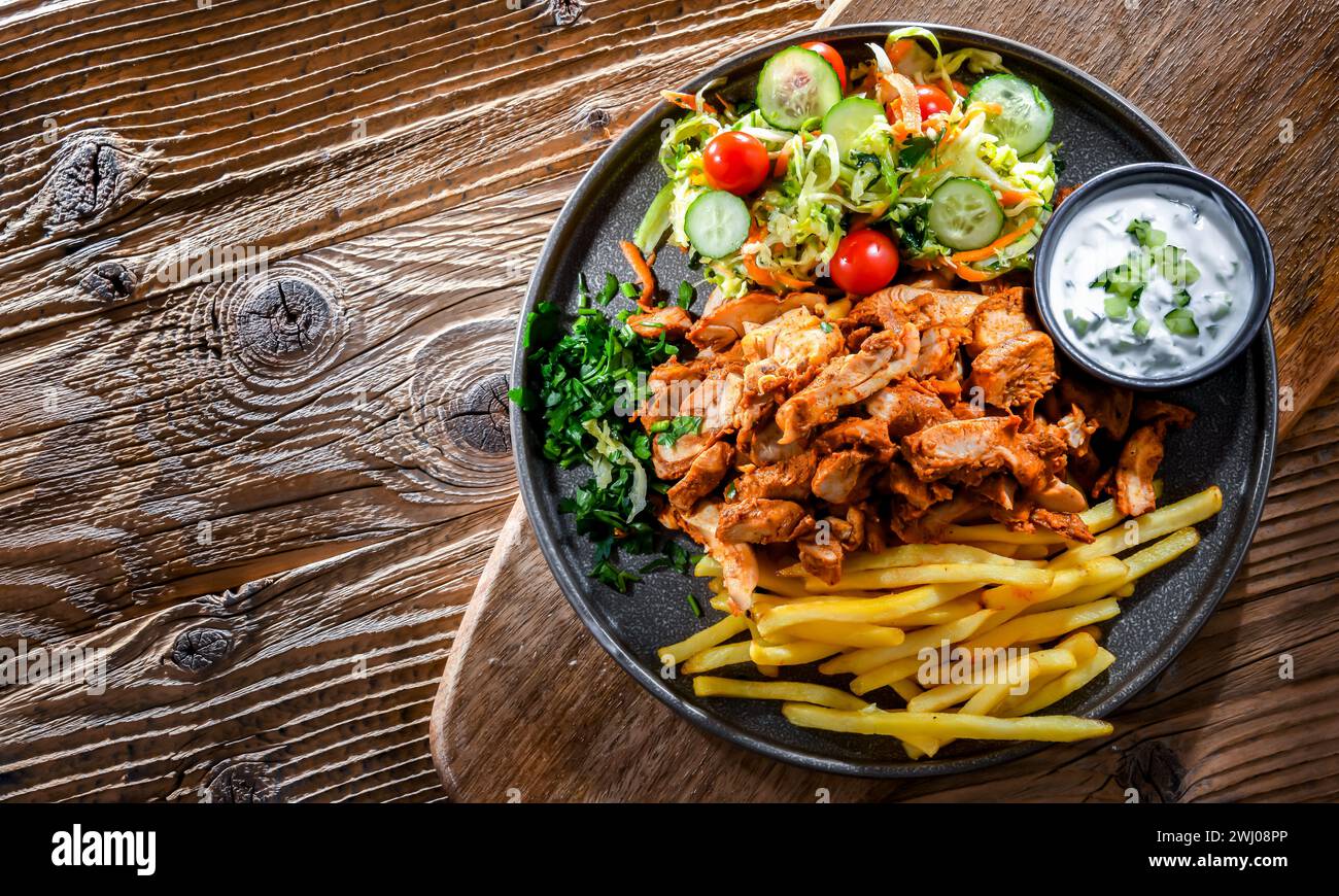 Kebab served with french fries Stock Photo - Alamy