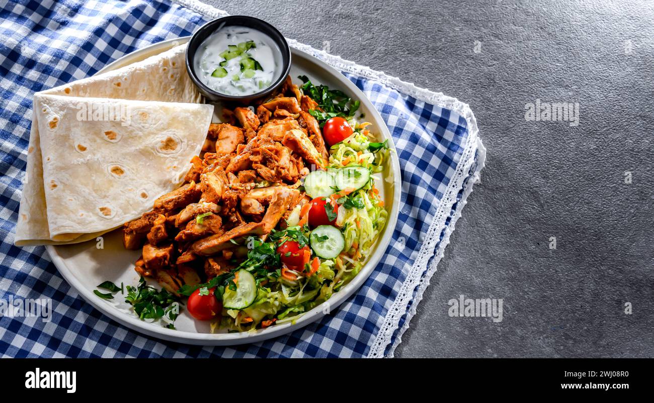 Kebab served with pita bread Stock Photo - Alamy