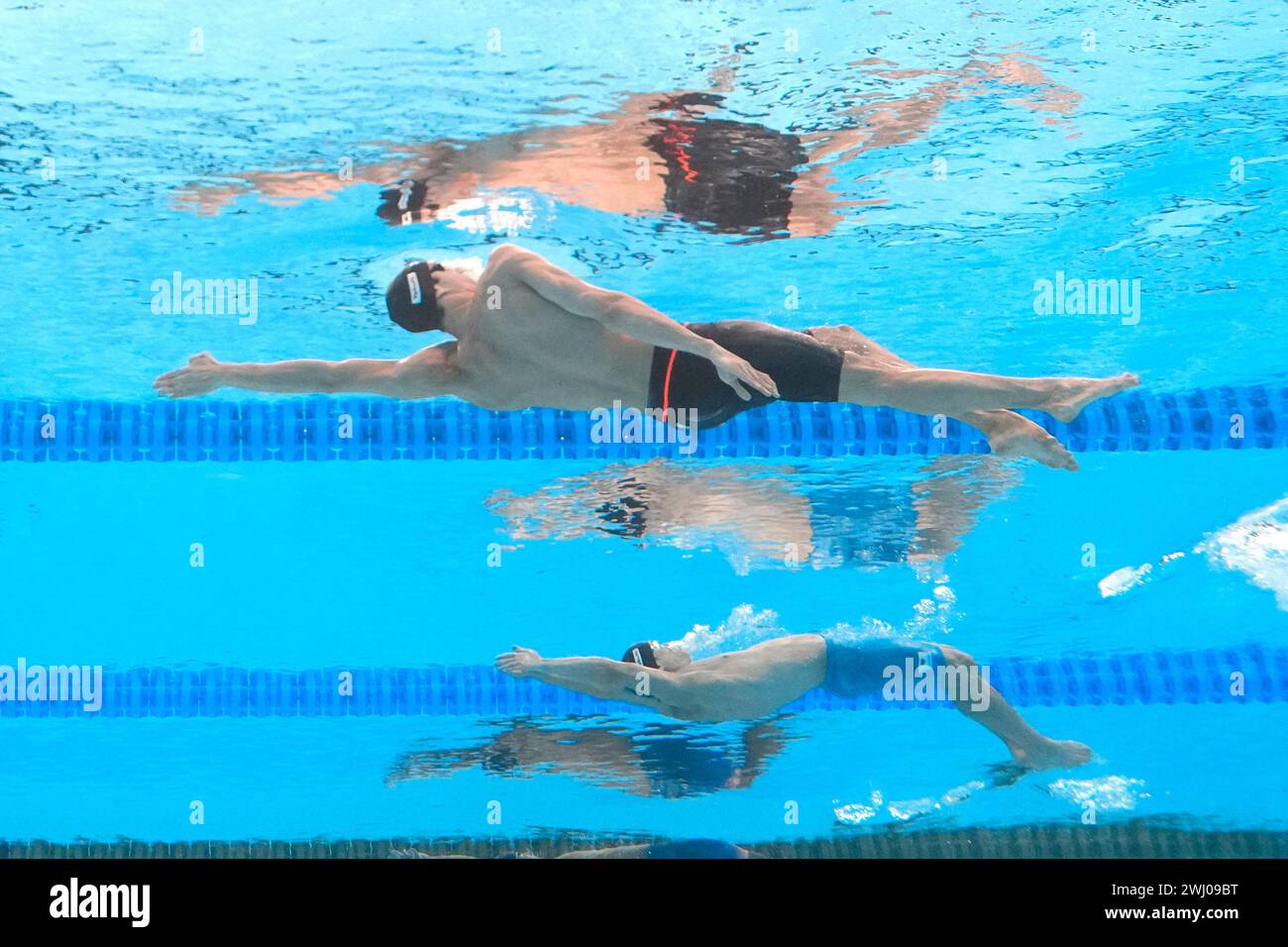 Michele Lamberti of Italy, top, and Osamu Kate of Japan compete in the men's 100-meter ...