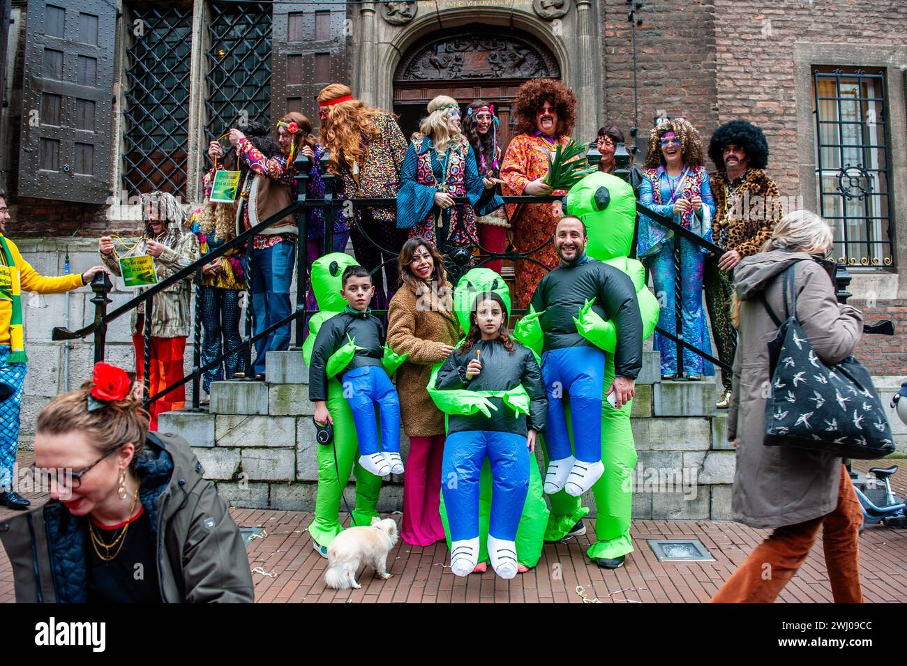 A family wearing funny costumes is seen taking a photo with Huber Bruls ...