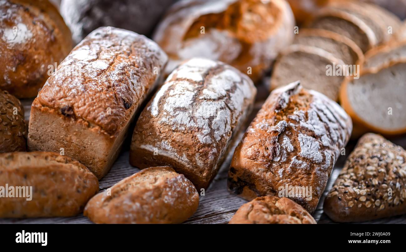 Assorted bakery products including loaves of bread and rolls Stock ...