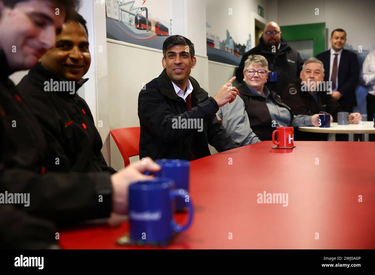 Prime Minister Rishi Sunak meets with bus drivers during his visit to a ...