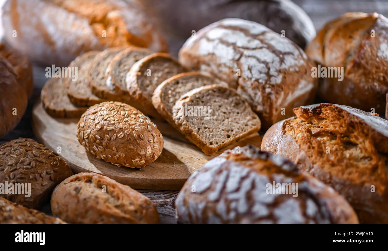Assorted bakery products including loaves of bread and rolls Stock ...