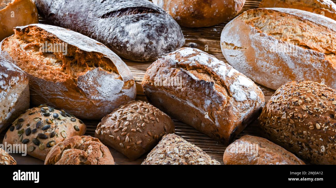 Assorted bakery products including loaves of bread and rolls Stock ...