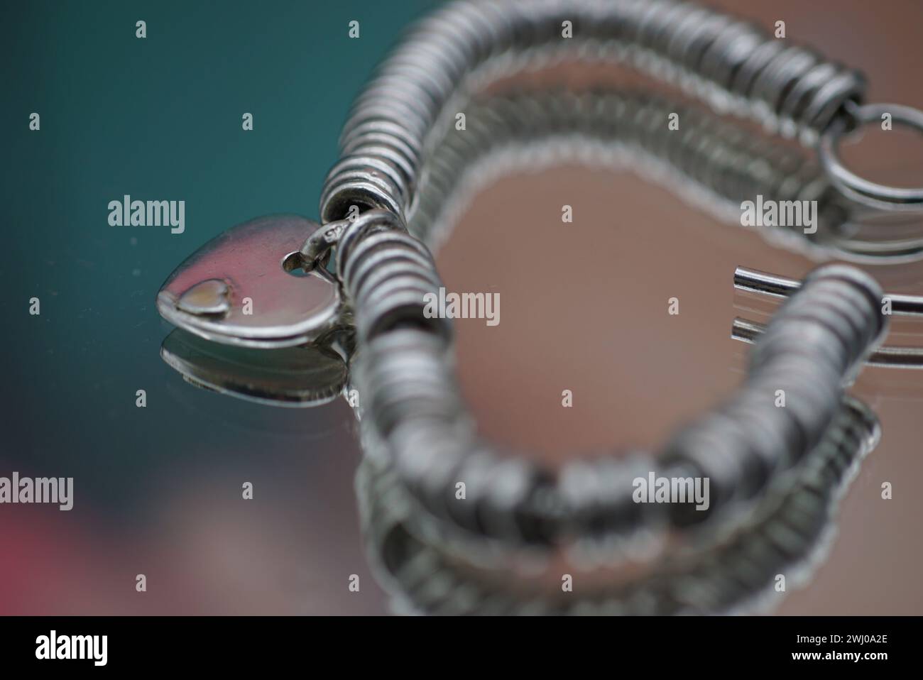 Metal piece connected to wire Stock Photo - Alamy