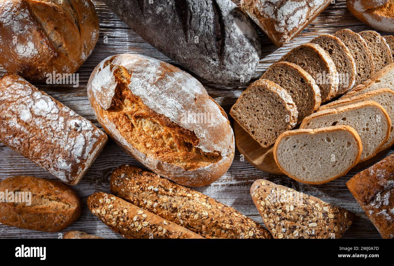 Assorted bakery products including loaves of bread and rolls Stock ...