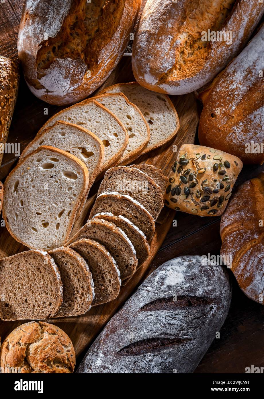 Assorted bakery products including loaves of bread and rolls Stock ...