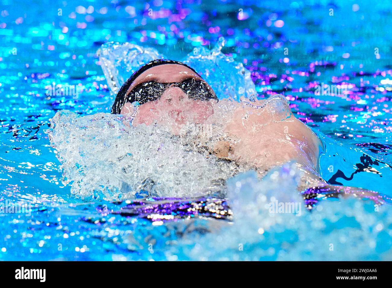 Ingrid Wilm of Canada competes in the women's 100-meter backstroke heat ...
