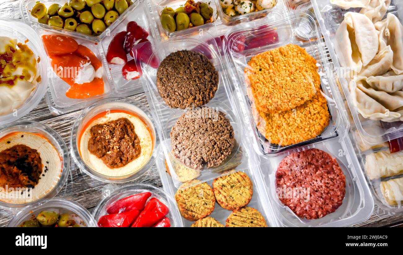 A display of variety of prepackaged food products in plastic boxes ...