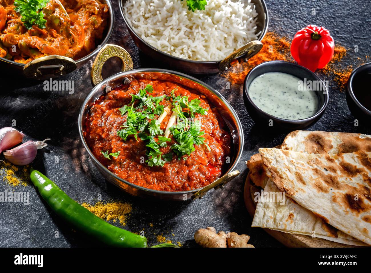 Hot madras paneer and vegetable masala with basmati rice served in ...