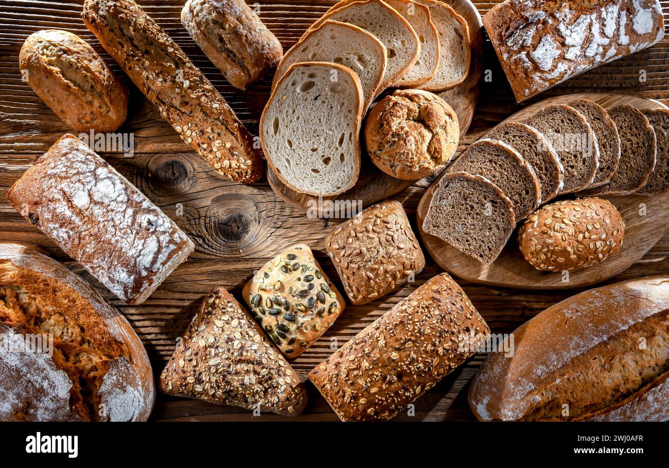 Assorted bakery products including loaves of bread and rolls Stock ...