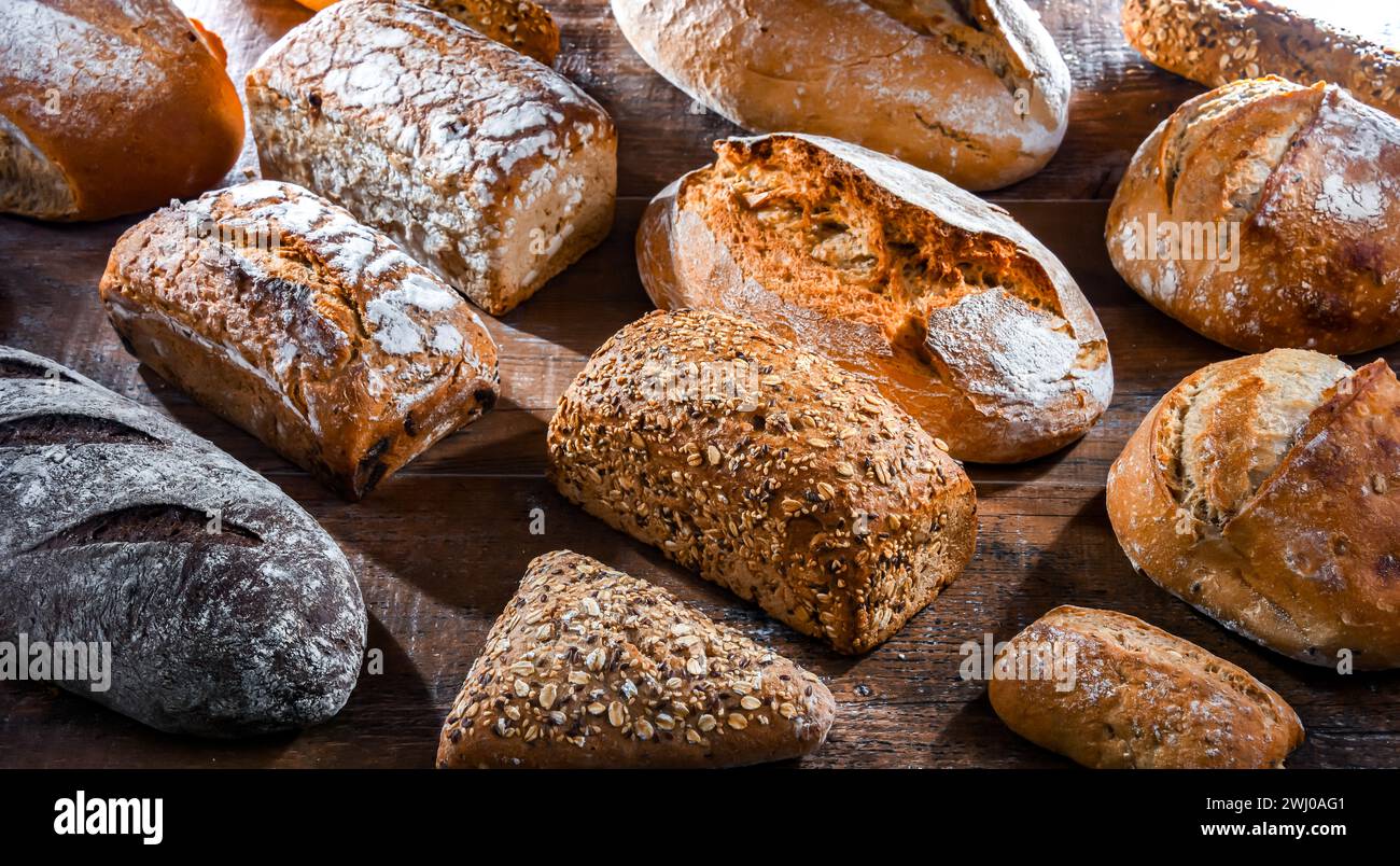 Assorted bakery products including loaves of bread and rolls Stock ...