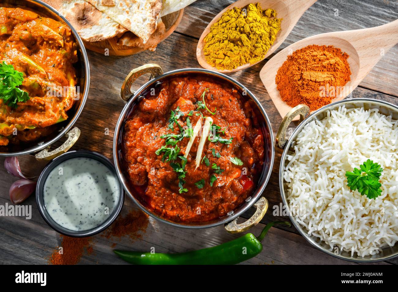 Hot madras paneer and vegetable masala with basmati rice served in ...