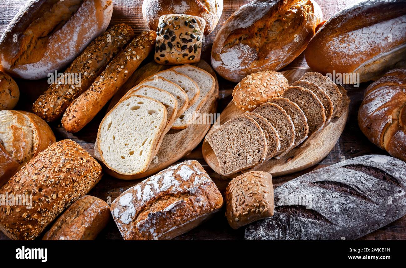 Assorted bakery products including loaves of bread and rolls Stock ...