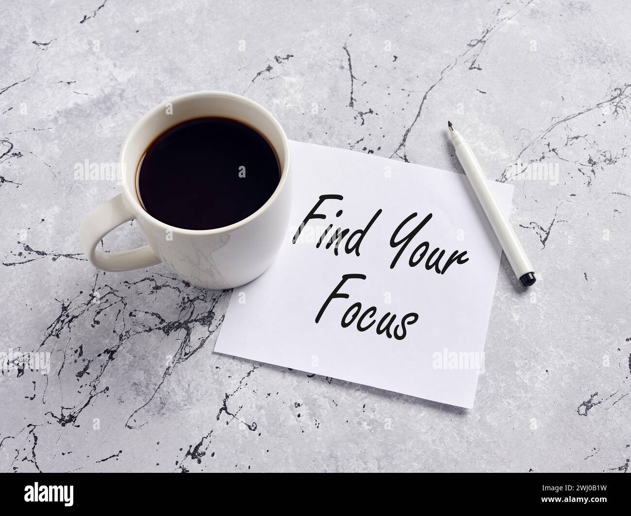 The inspirational message find your focus handwritten on a paper with ...