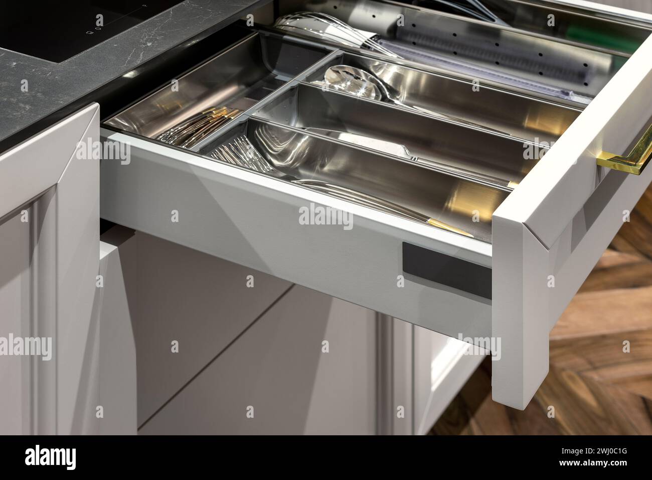 Metal kitchen drawer organizer in wood kitchen with simple set of ...