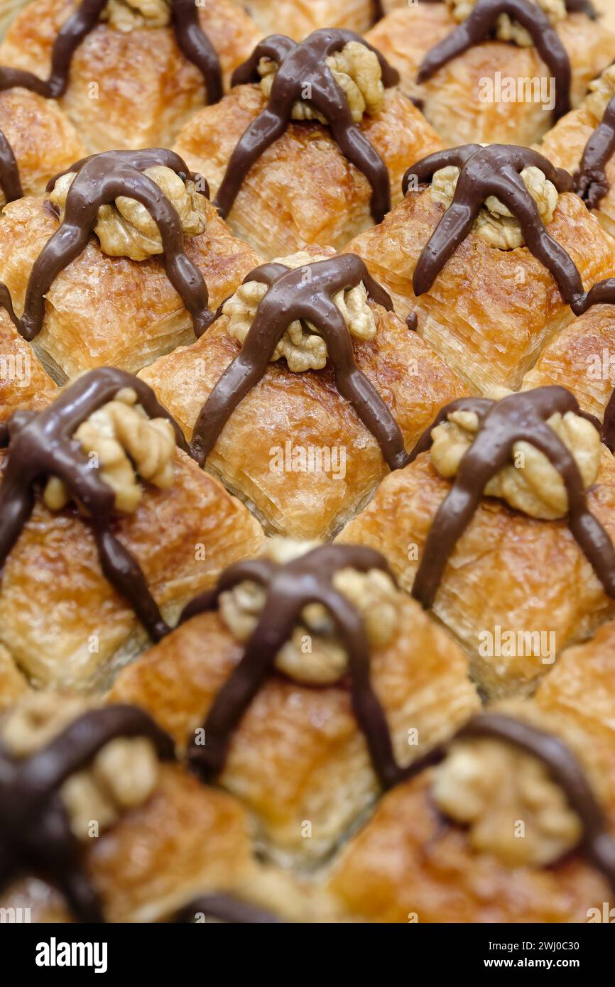 Traditional Turkish dessert, baklava, decorated with walnuts and ...