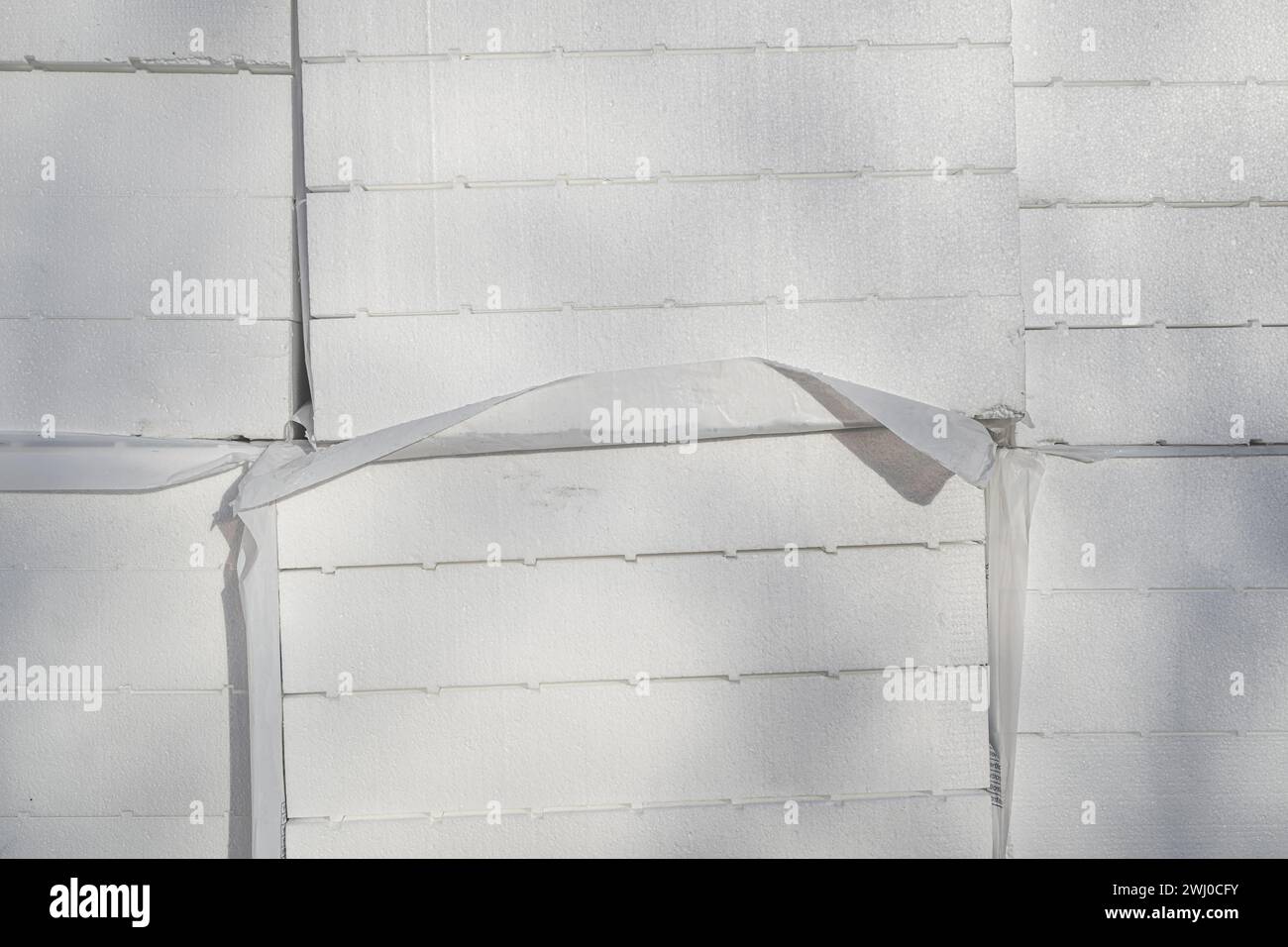Stack of styrofoam insulation boards on construction site, selective ...